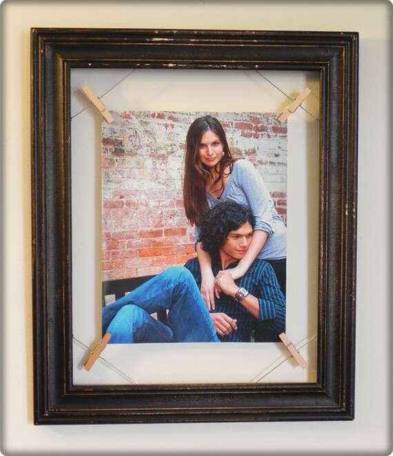 Items similar to Redesigned picture frame, clothes pins on wire ...