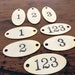 Hand Punched Brass Oval Numbered Tags - Custom Numbered Locker Tags ...