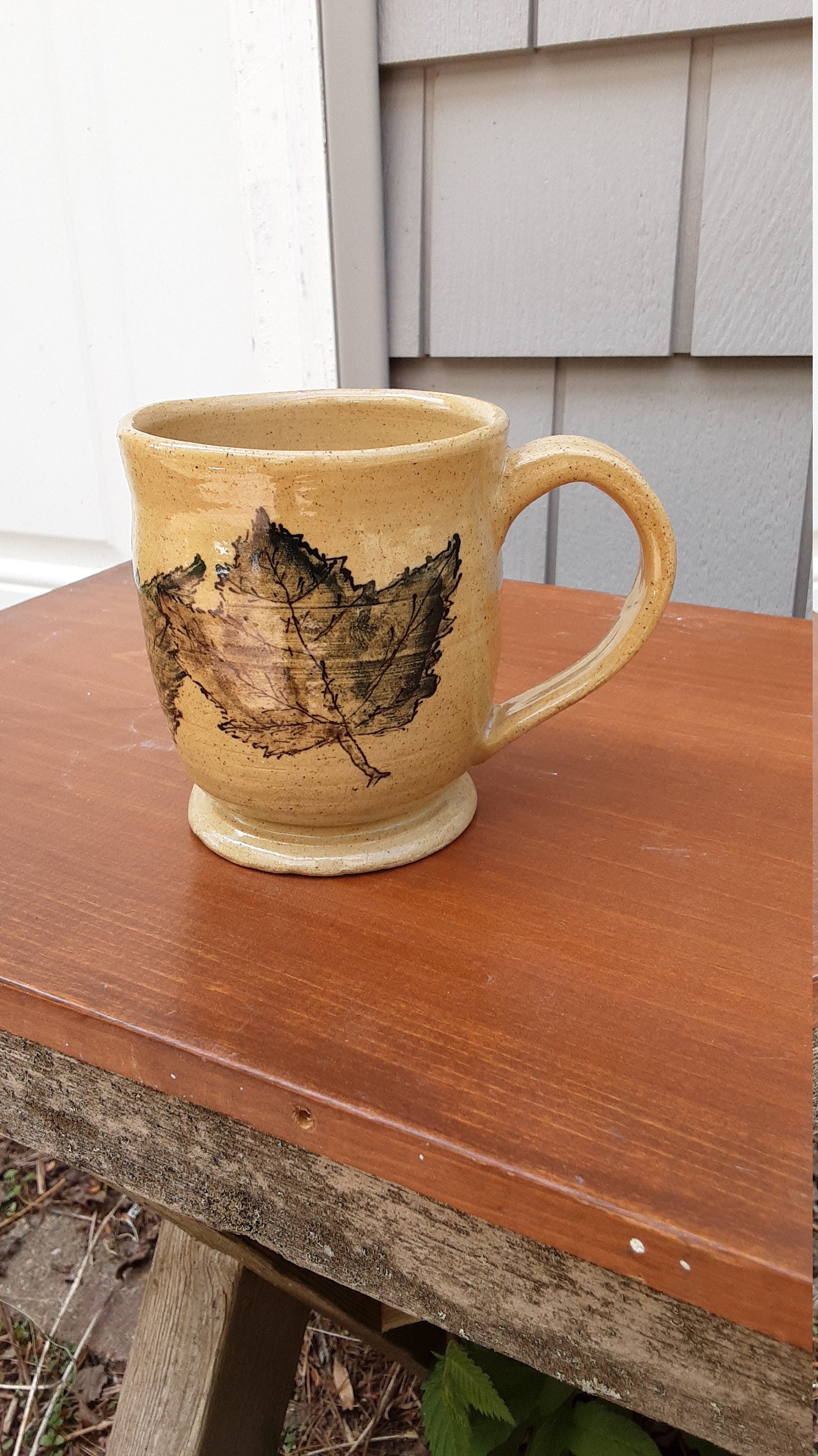 Coffee mug with underglaze leaves with slip trailed detail holds 12oz