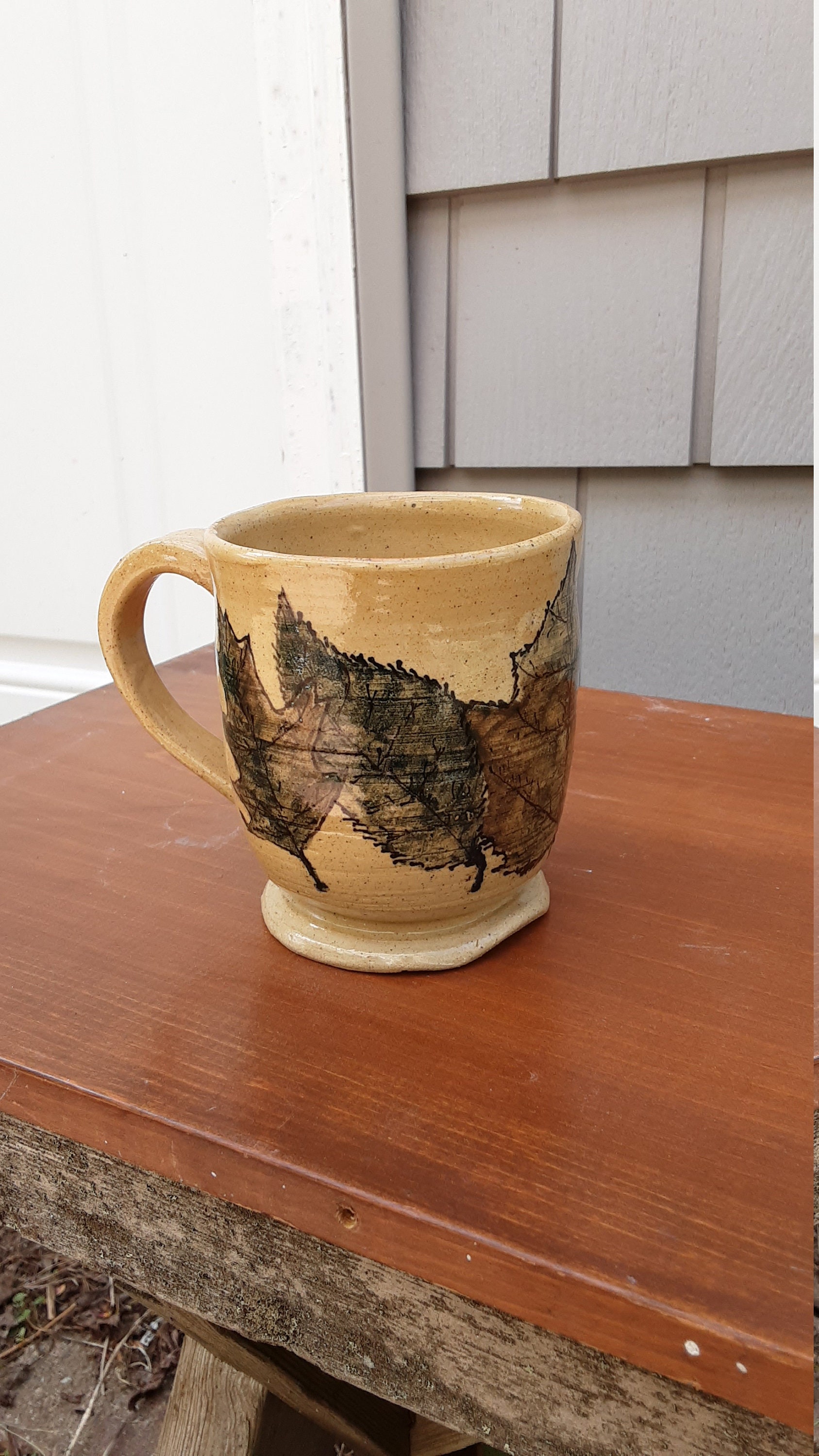 Coffee mug with underglaze leaves with slip trailed detail holds 12oz