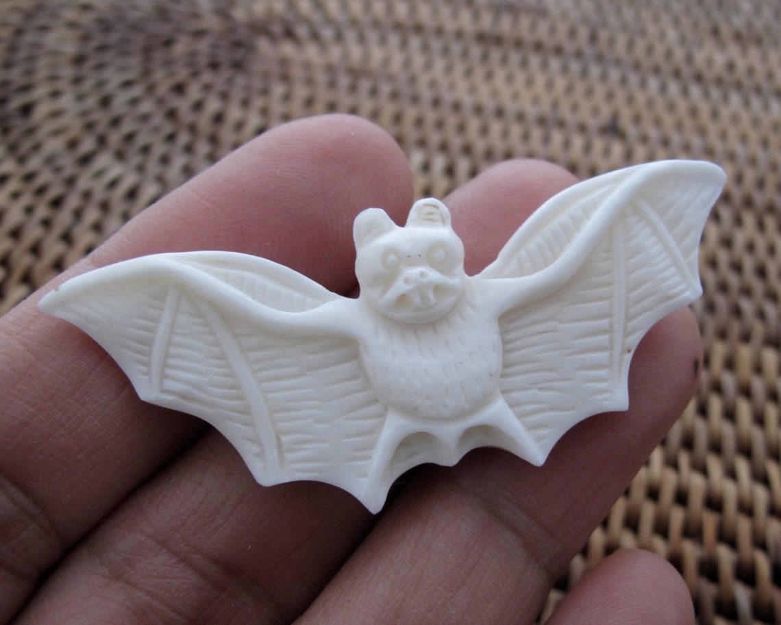 Amazing detail Hand Carved Bat Buffalo bone carving | Etsy