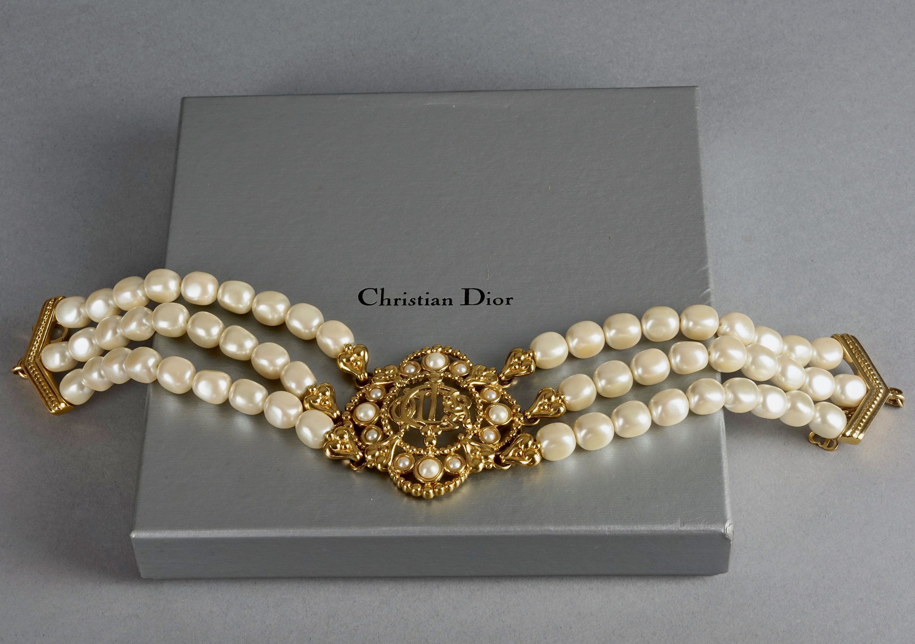 Vintage CHRISTIAN DIOR Logo Insignia Medallion Tiered Pearl Vintage CHRISTIAN DIOR Logo Insignia Medallion Tiered Pearl