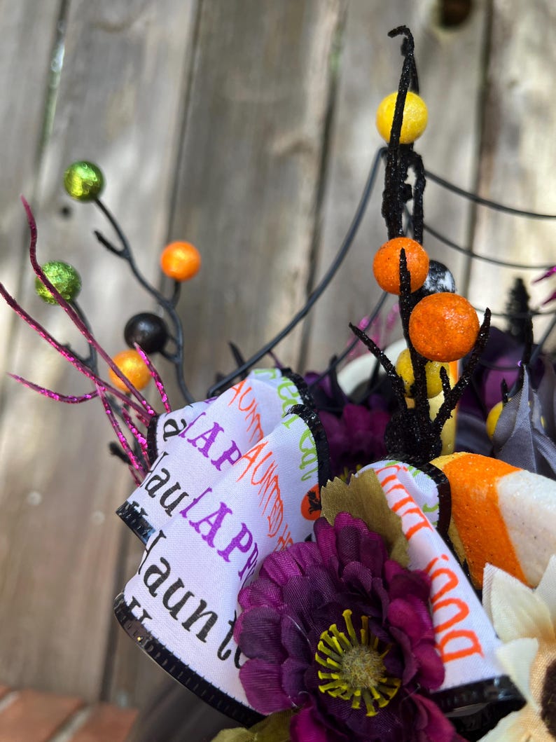 Halloween Floral Arrangement Featuring Black Pumpkin and Spooky Accents ...