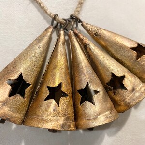 STAR BELLS - Group of Rustic Gold Cone-shaped Bells With Star Cut-outs ...