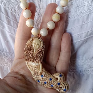 Carved Mermaid Pendant Necklace, Yellow Pearly Troca Shell Bead ...
