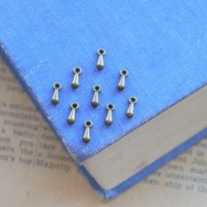 100 Pcs Antique Bronze Small Drops Necklace Ends 7mm BC1052 - Etsy