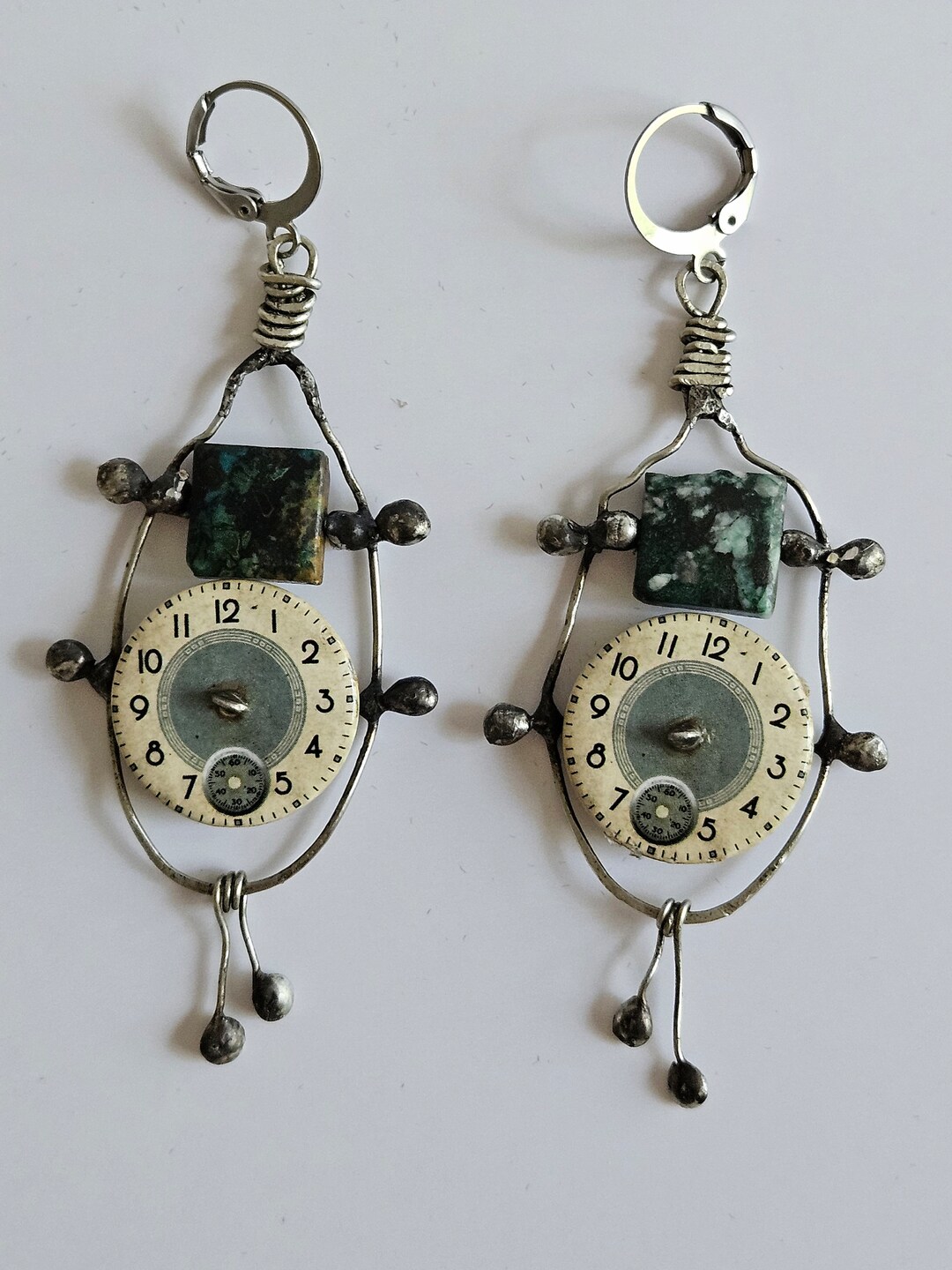 Swinging Clocks. Buttons, Stones, Are Wire Caged and a Pendulum Has ...