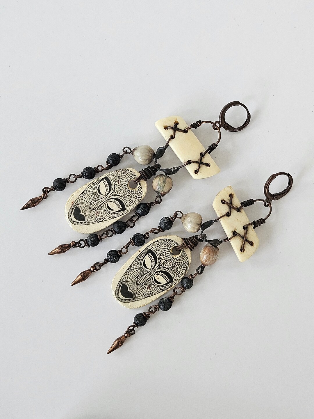 African Masks, Hang From Bone Beads That Have Been Embellished With ...