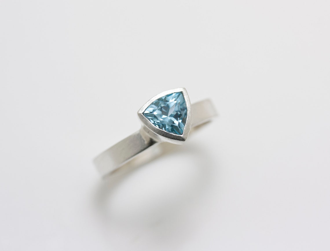Sterling Silver Bezel Set Trillion Faceted Blue Topaz Engagement Ring ...