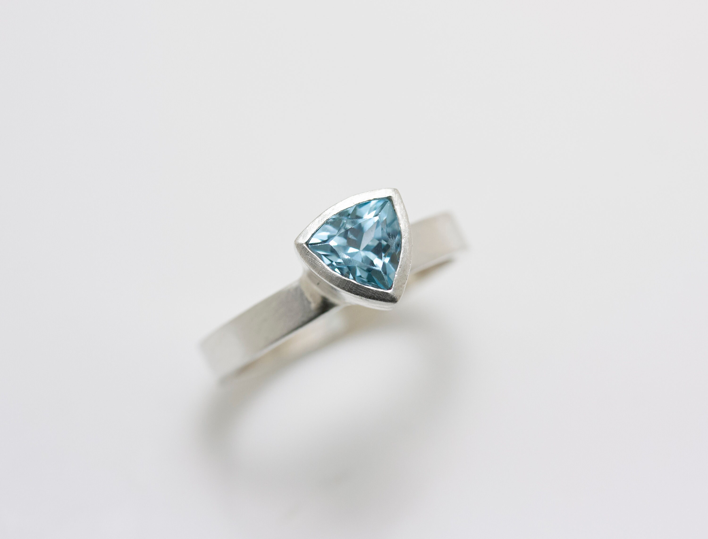 Sterling Silver Bezel Set Trillion Faceted Blue Topaz Engagement Ring ...