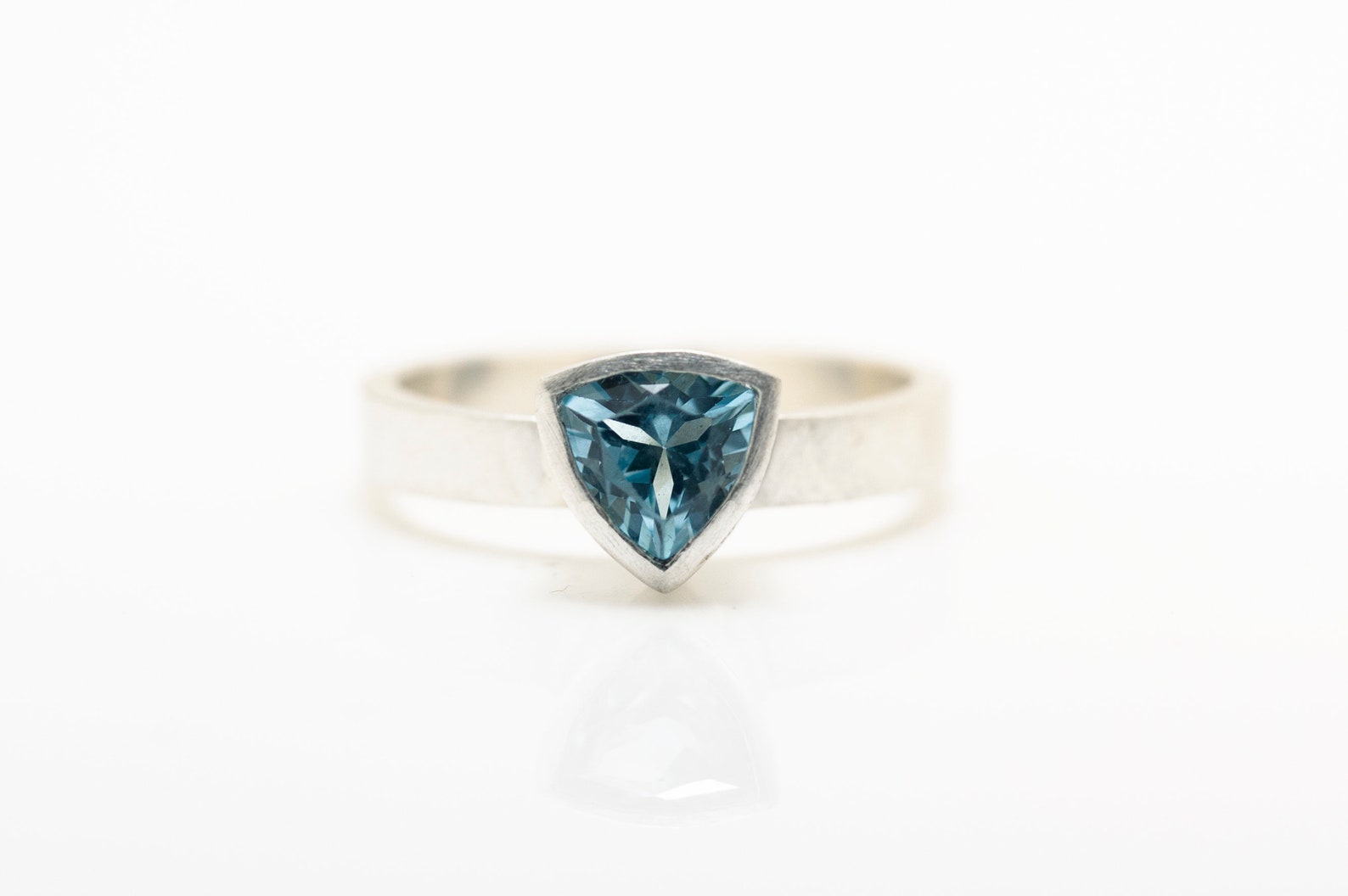Sterling Silver Bezel Set Trillion Faceted Blue Topaz Engagement Ring ...