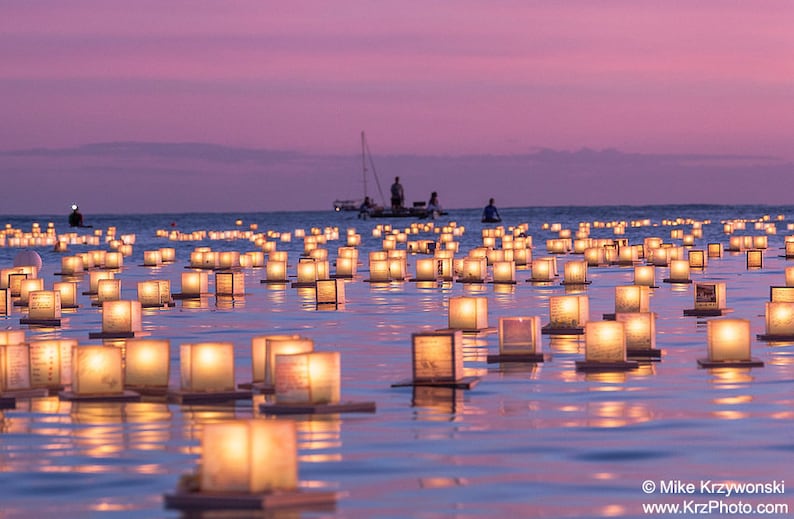 Photo of Floating Lanterns in the Ocean Under a Pink Sunset in Honolulu ...