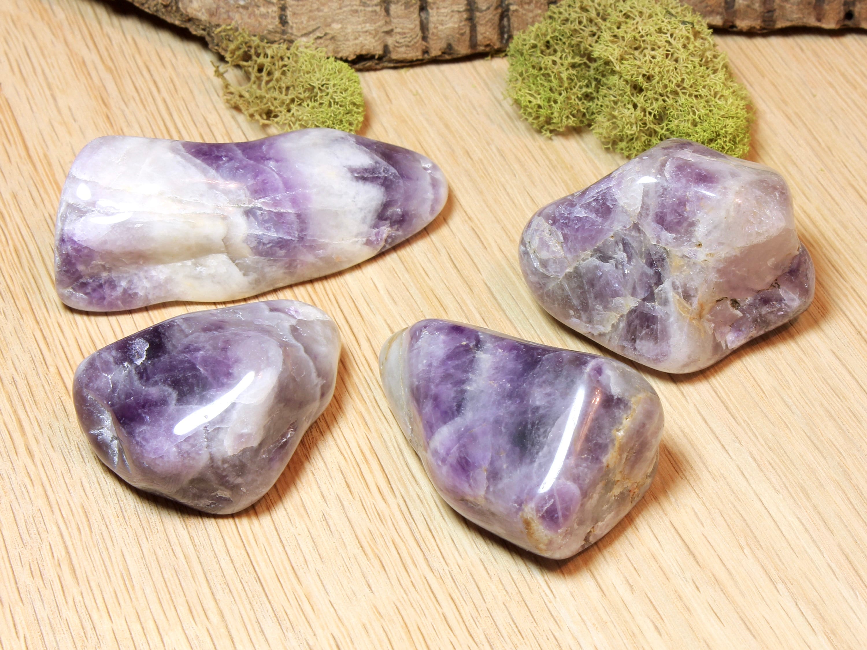 Set Of Various Unpolished Purple Stones With Names Cutout On White ...