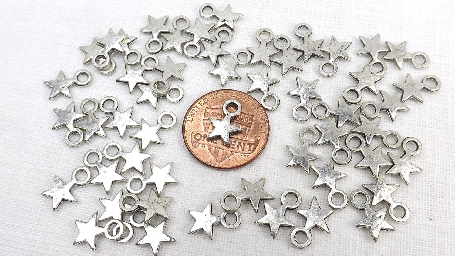 Star Charms 50 pieces 8 mm stars two sided flat antiqued | Etsy