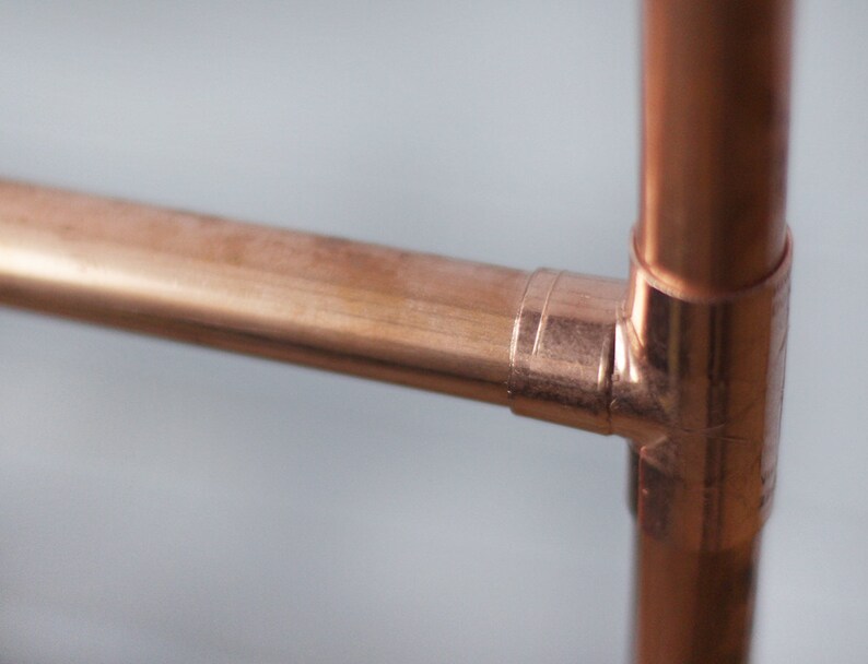 Handmade industrial copper rose gold tone clothes frame rack | Etsy