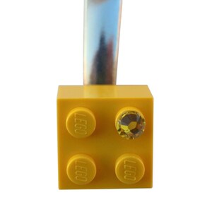 Yellow LEGO® Brick 2x2 With a Yellow SWAROVSKI® Crystal on a Silver ...