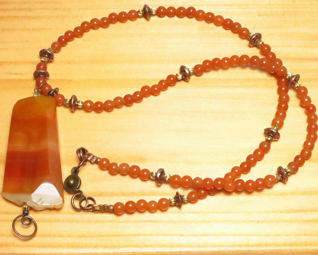 Freeform Gemstone Pendant. Red Agate Pendant on Strand of Red Agate ...