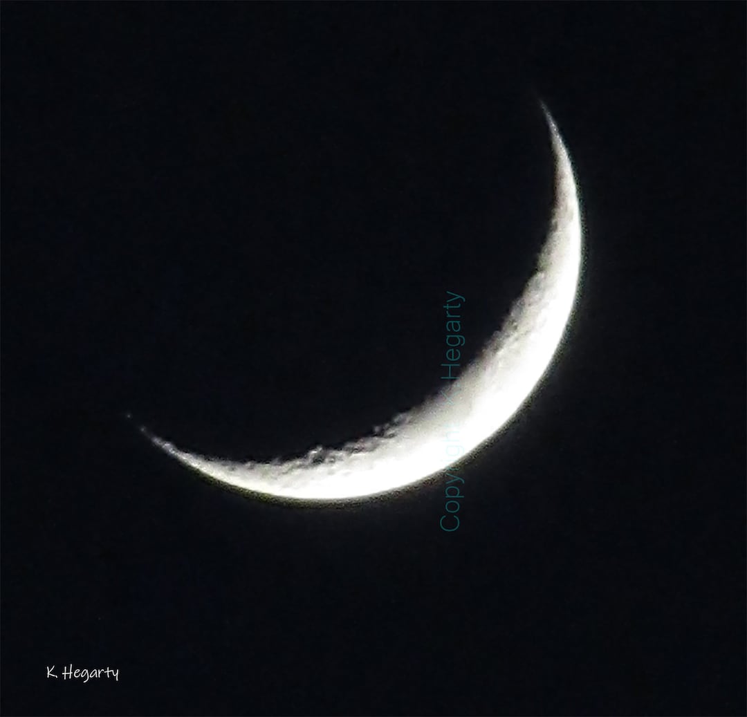 Photograph - Crescent Moon - Sharp Crescent Moon Against a Black Sky ...