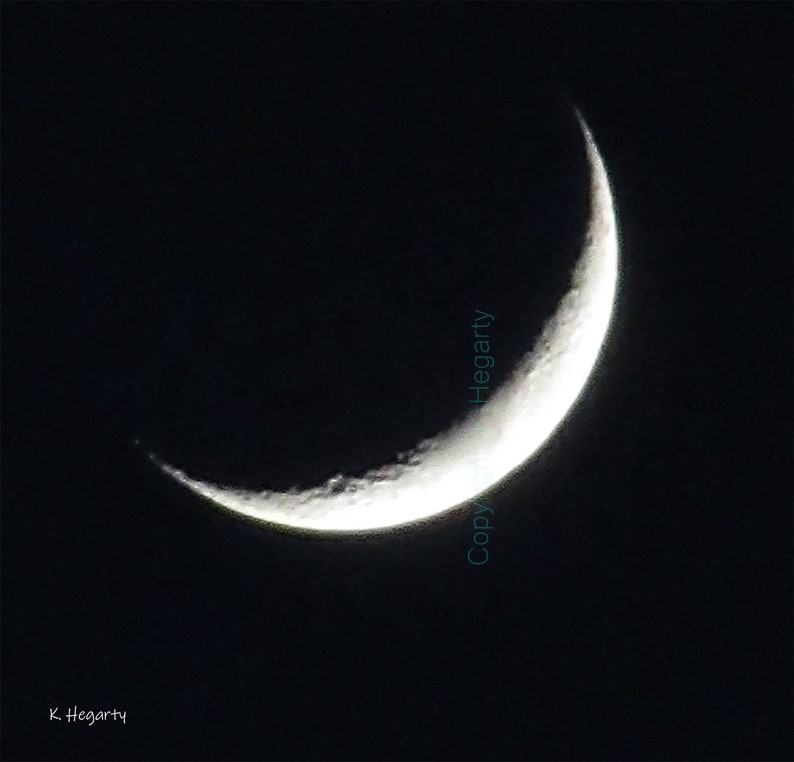 Photograph - Crescent Moon - Sharp Crescent Moon Against a Black Sky ...