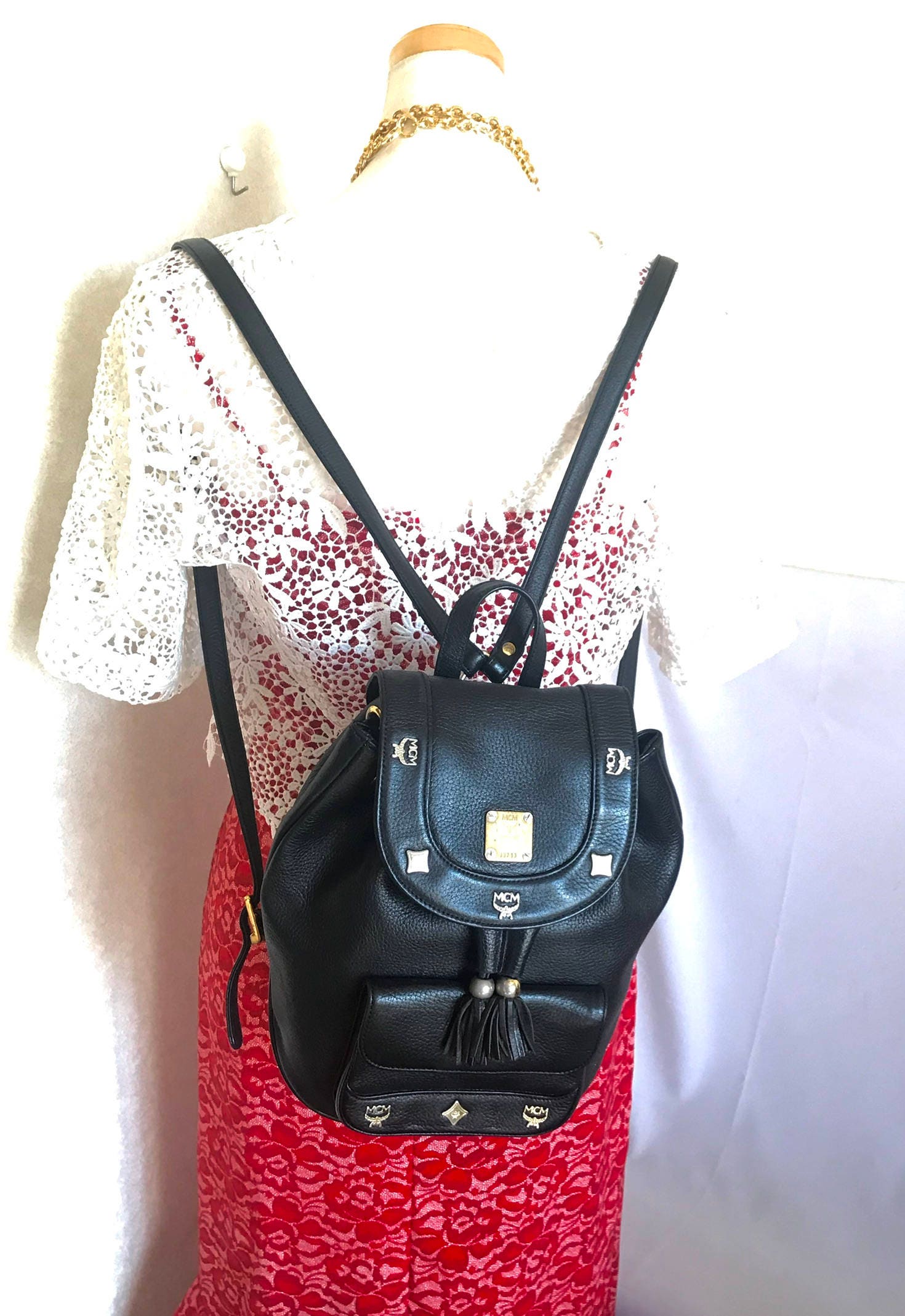 Vintage MCM Black Backpack With Golden Studded Logo Motifs Vintage MCM Black Backpack With Golden Studded Logo Motifs