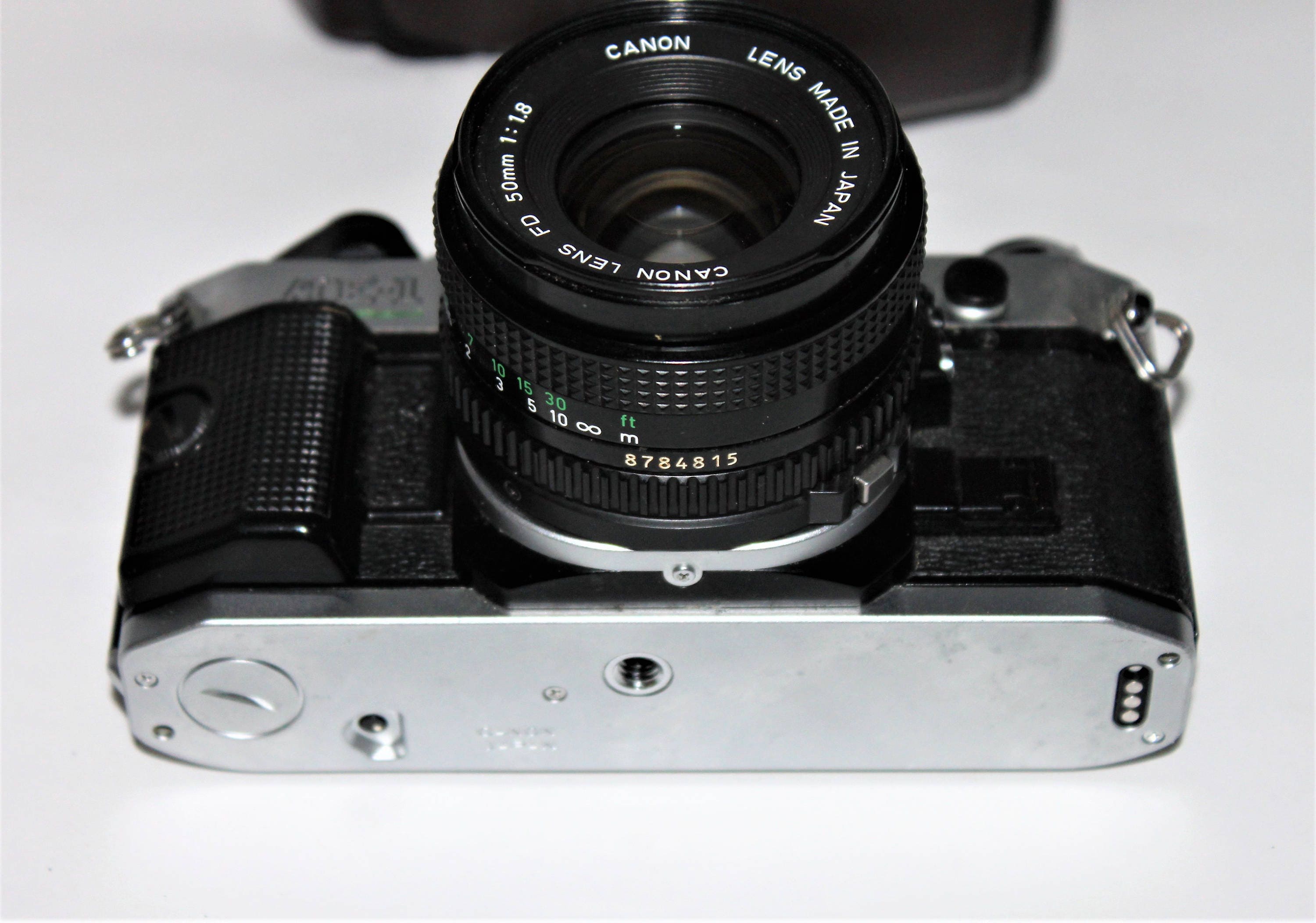 Vintage 1980s Canon AE-1 35mm Film Camera with Leather Case Vintage 1980s Canon AE-1 35mm Film Camera with Leather Case