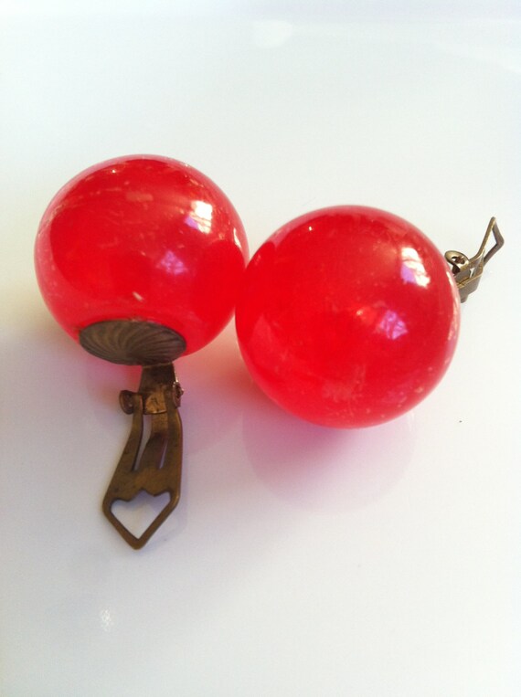 Items similar to Red red red superball sized earrings on Etsy