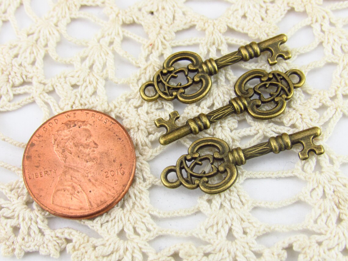 Filigree Vintage Look Small Skeleton Key Charm Bronze 6 - Etsy