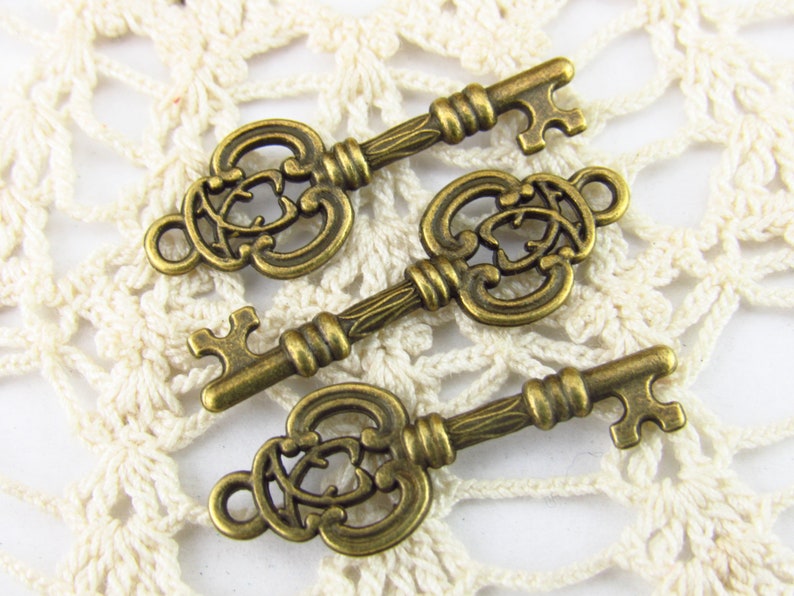 Filigree Vintage Look Small Skeleton Key Charm Bronze 6 - Etsy