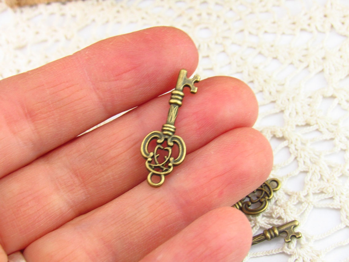 Filigree Vintage Look Small Skeleton Key Charm Bronze 6 - Etsy