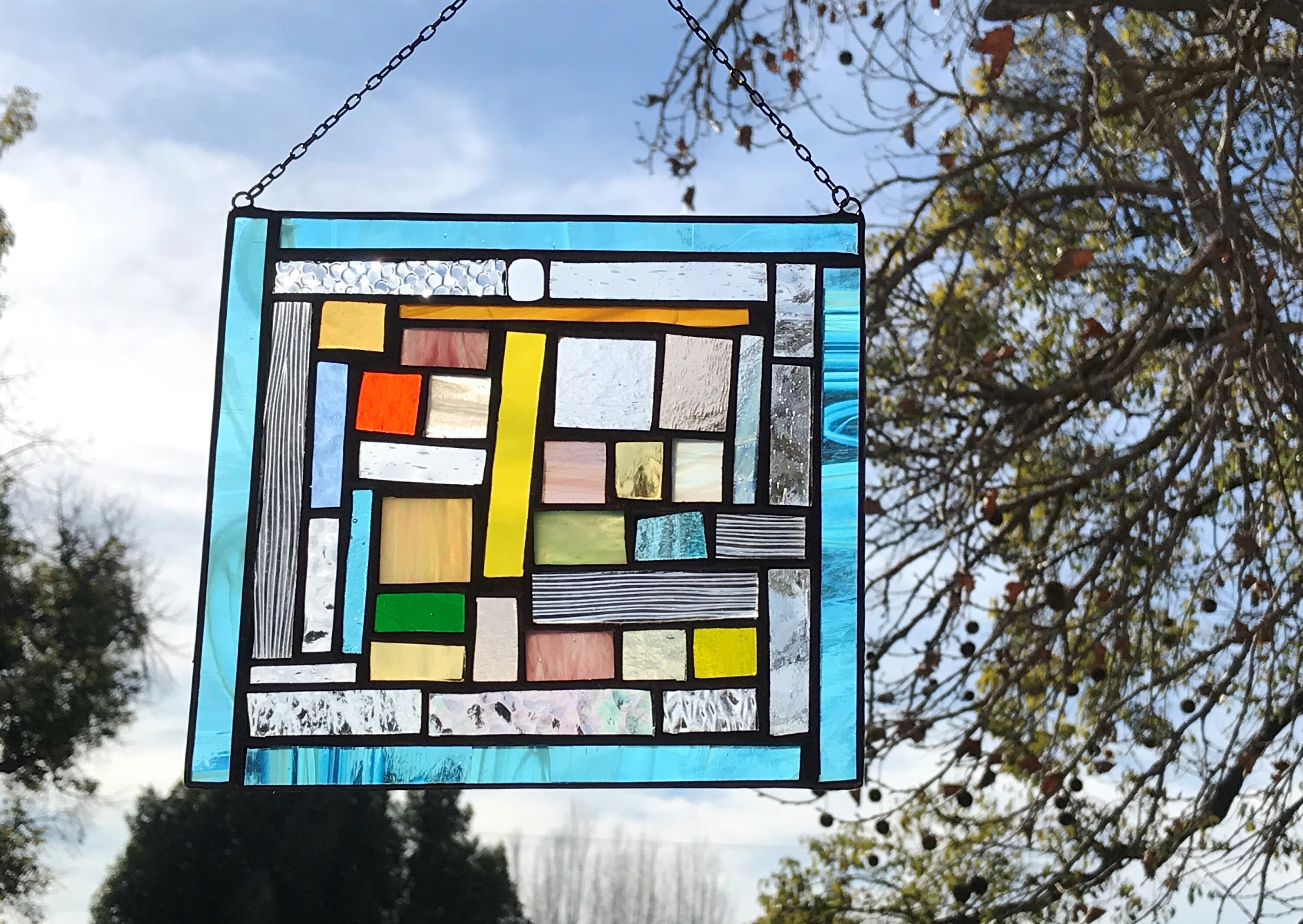 Multicolored Geometric Stained Glass Panel