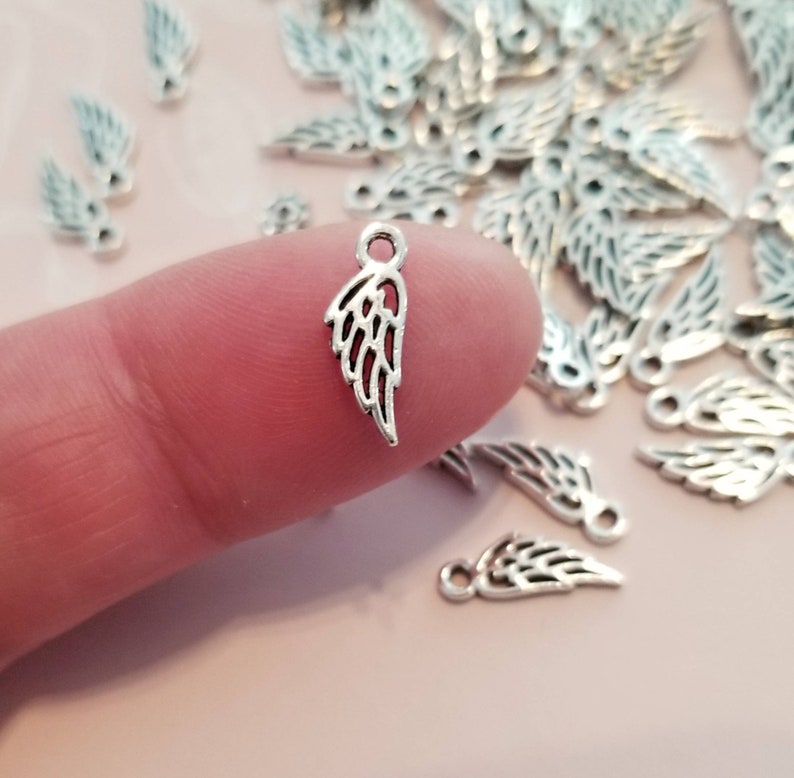 14 Tiny Filigree Wing Charms Mini Angel Wings Sweet Little - Etsy