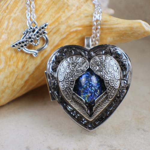 A Bronze Angel Wing Mini Music Box Locket With Dragons Breath | Etsy