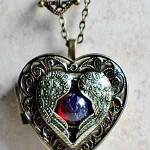 A Bronze Angel Wing Mini Music Box Locket With Dragons Breath | Etsy