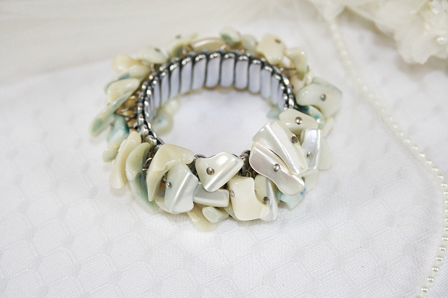 Polished Shell Expansion Bracelet off White With Blue Highlights ...