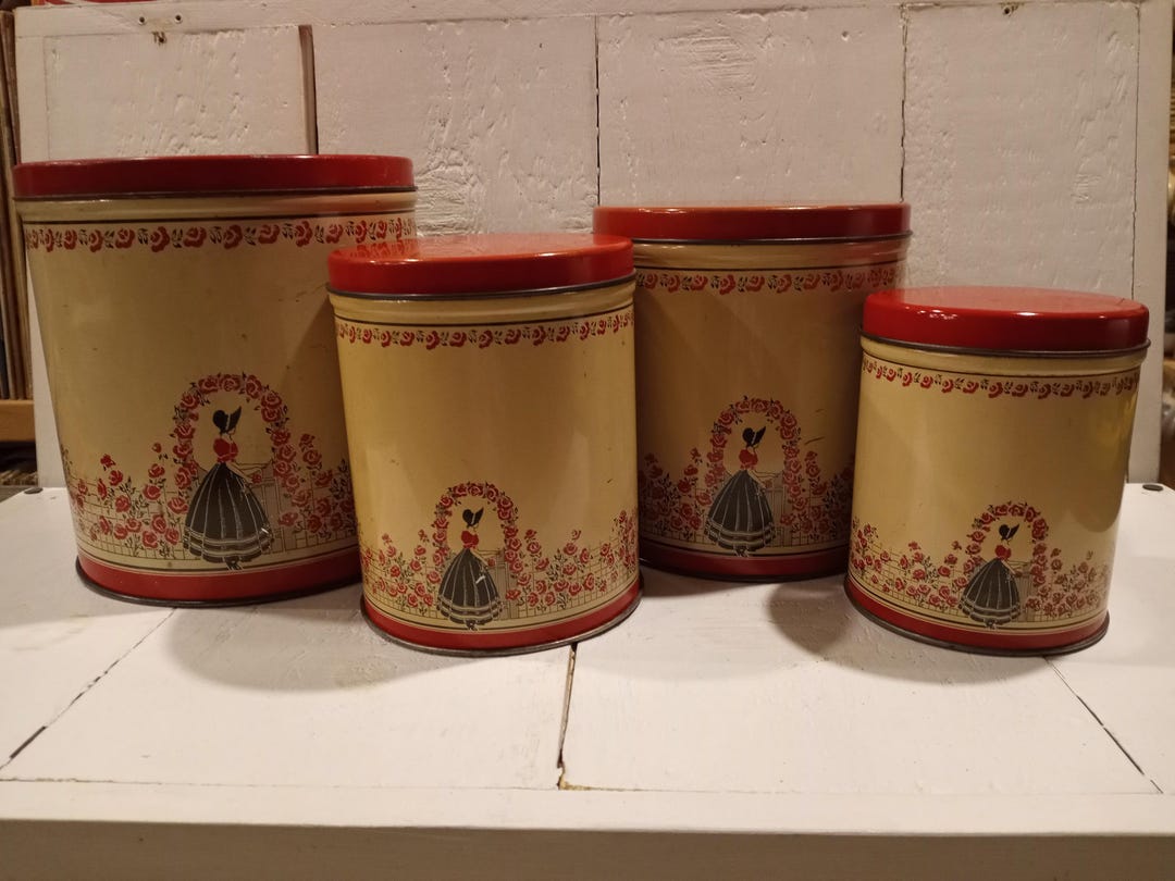 ANTIQUE CANISTER SET Four Pieces Metal With Lids Lady in Bonnet Under ...