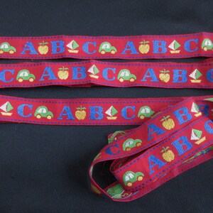 ABC Jacquard Ribbon Braid, Bright Primary Colors on Red Woven Ribbon ...