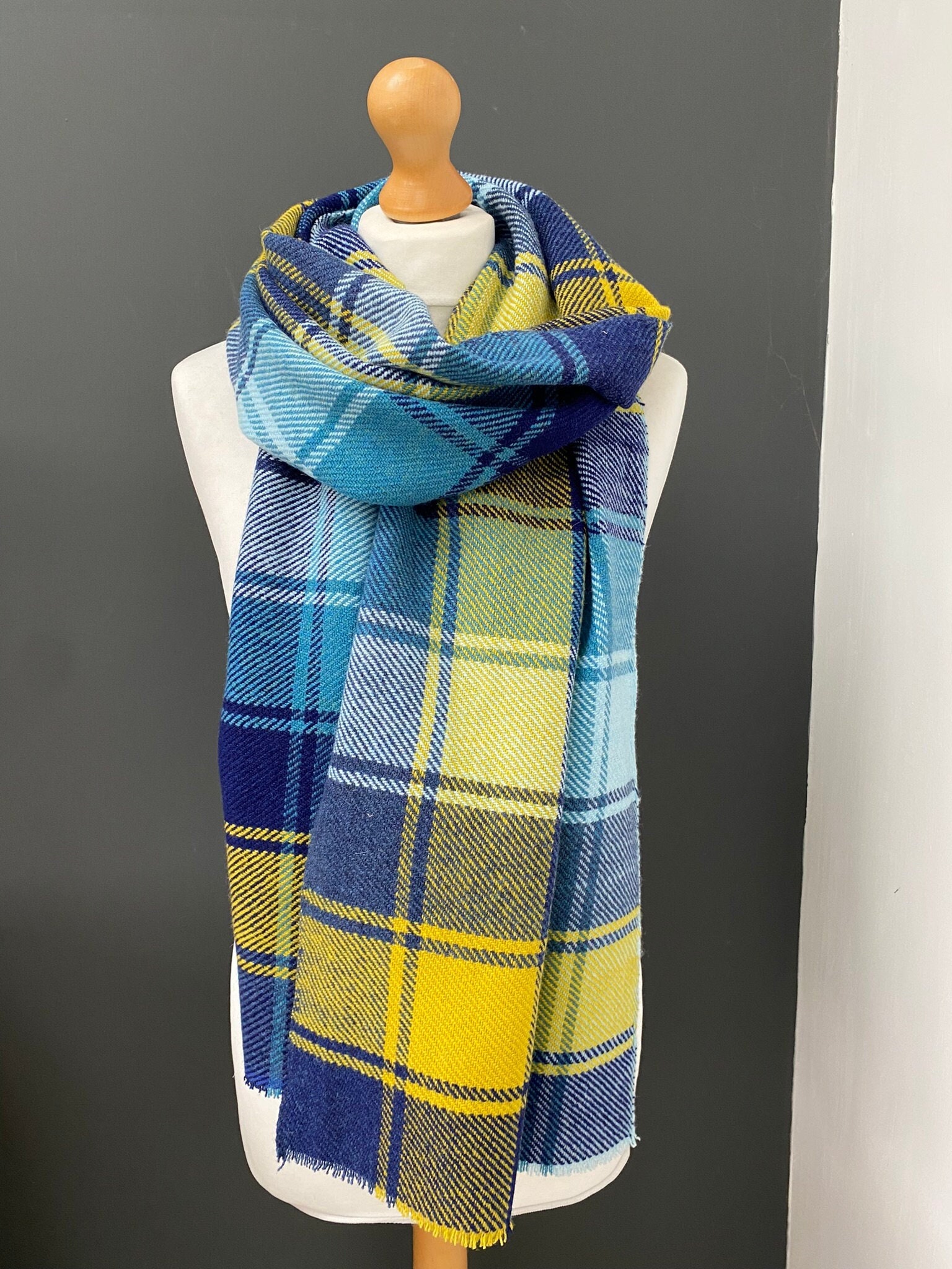 Handwoven navy blue and yellow oversize scarf woven using merino lambswool to create a luxury shawl and a perfect gift