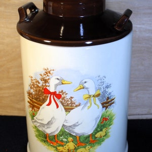 Three Piece Canister Set With Milk Can Design and Two Geese or Ducks on ...