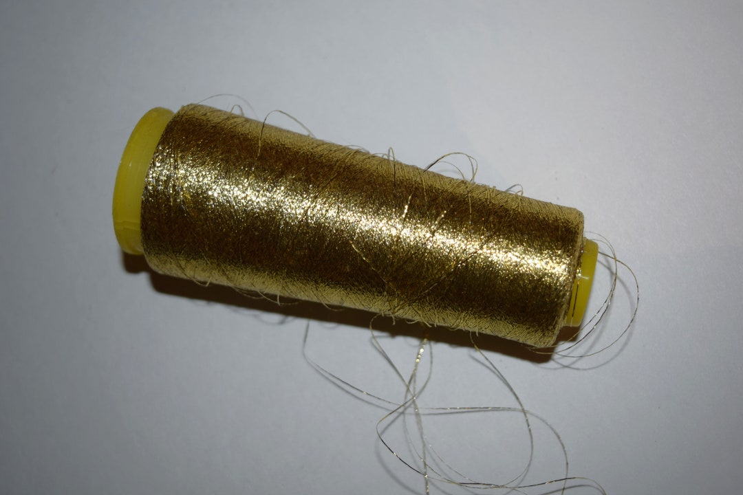 Spool of Lurex Metallic Yarn, Thread. 1.2 Oz Gold Shaded. Shining ...