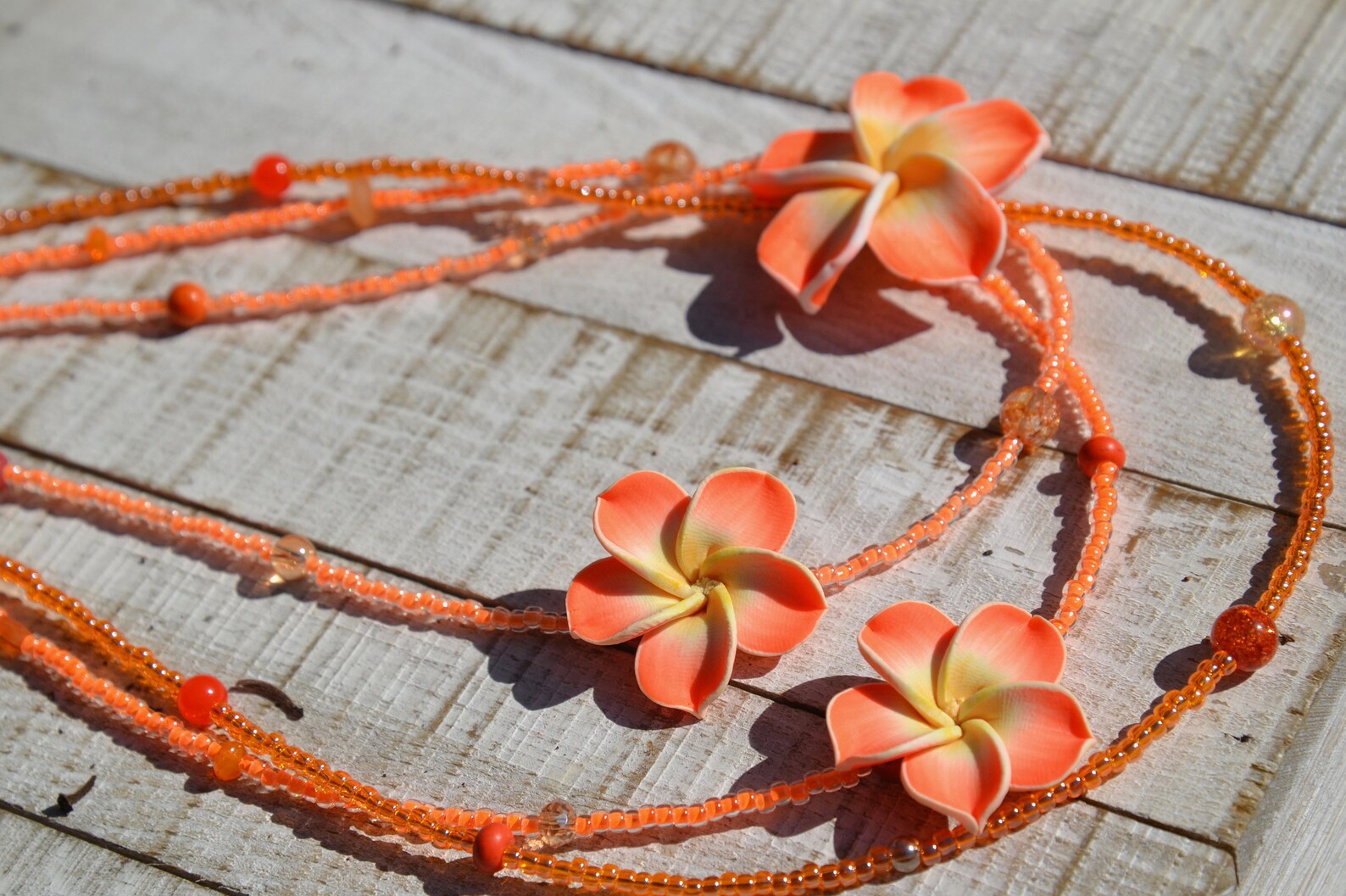 A Piece of Hawaii, Longer Plumeria Triple Strand Necklace in Orange ...