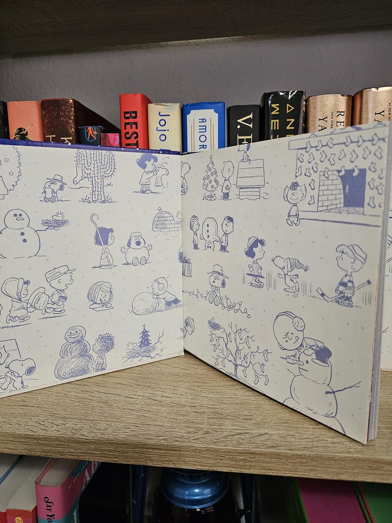 The Joy of a Peanuts Christmas: 50 Years of Holiday Comics by Charles ...