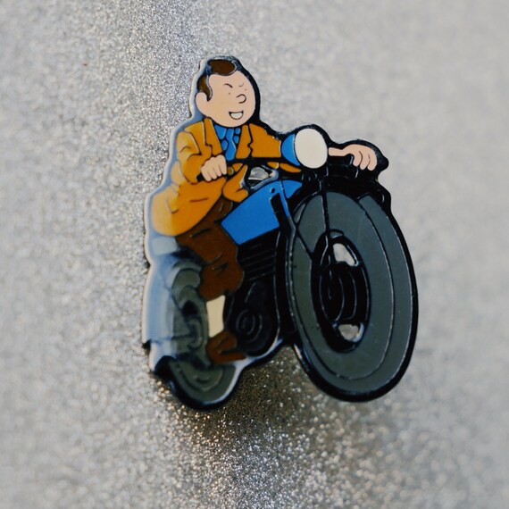 Tintin riding a motorcycle - vintage enamel pin from … - Gem