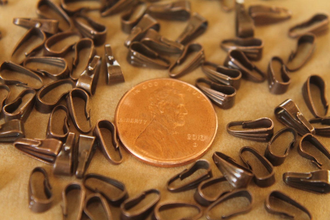 100 Pc. Antique Copper Plated Brass Pinch Bails: 9mm by 3mm - Etsy