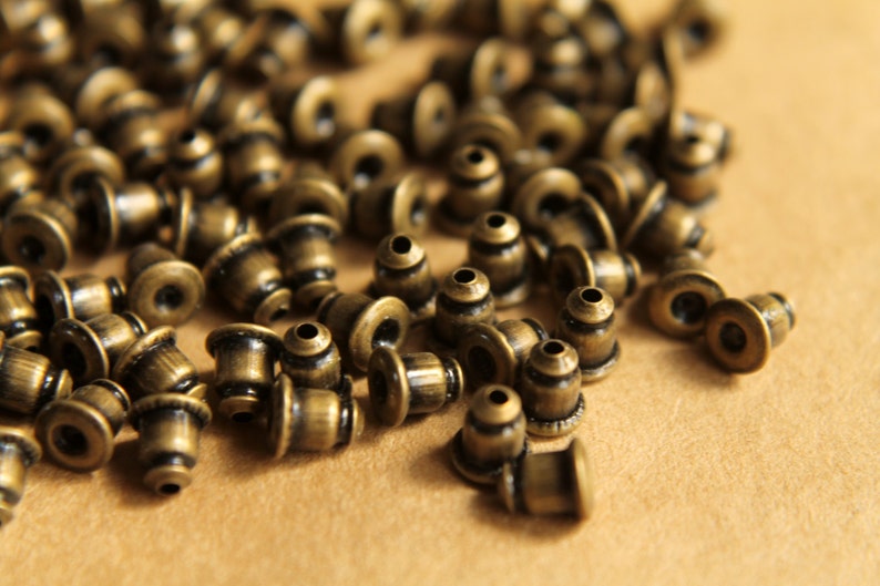 100 Pc. Antique Bronze Plated Bullet Earnuts, Nickel Free | FI-159 - Etsy