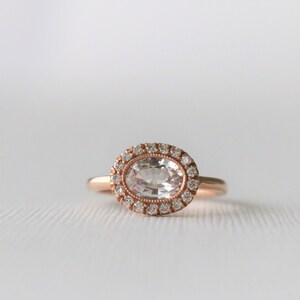 1.01 Ct. Oval Light Peach Sapphire Milgrain Bezel Halo Ring in 14K Rose ...