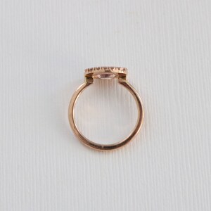 1.01 Ct. Oval Light Peach Sapphire Milgrain Bezel Halo Ring in 14K Rose ...