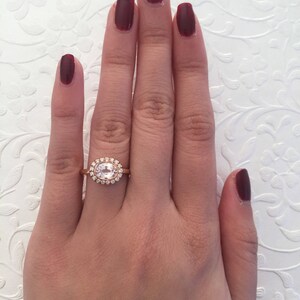 1.01 Ct. Oval Light Peach Sapphire Milgrain Bezel Halo Ring in 14K Rose ...