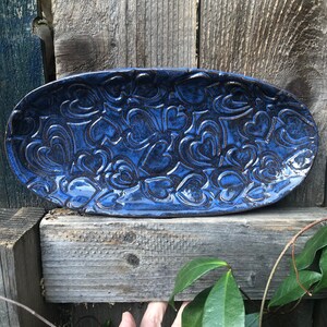Handcrafted Oval Platter in Deep Blue Glaze, Adorned With an Assortment ...