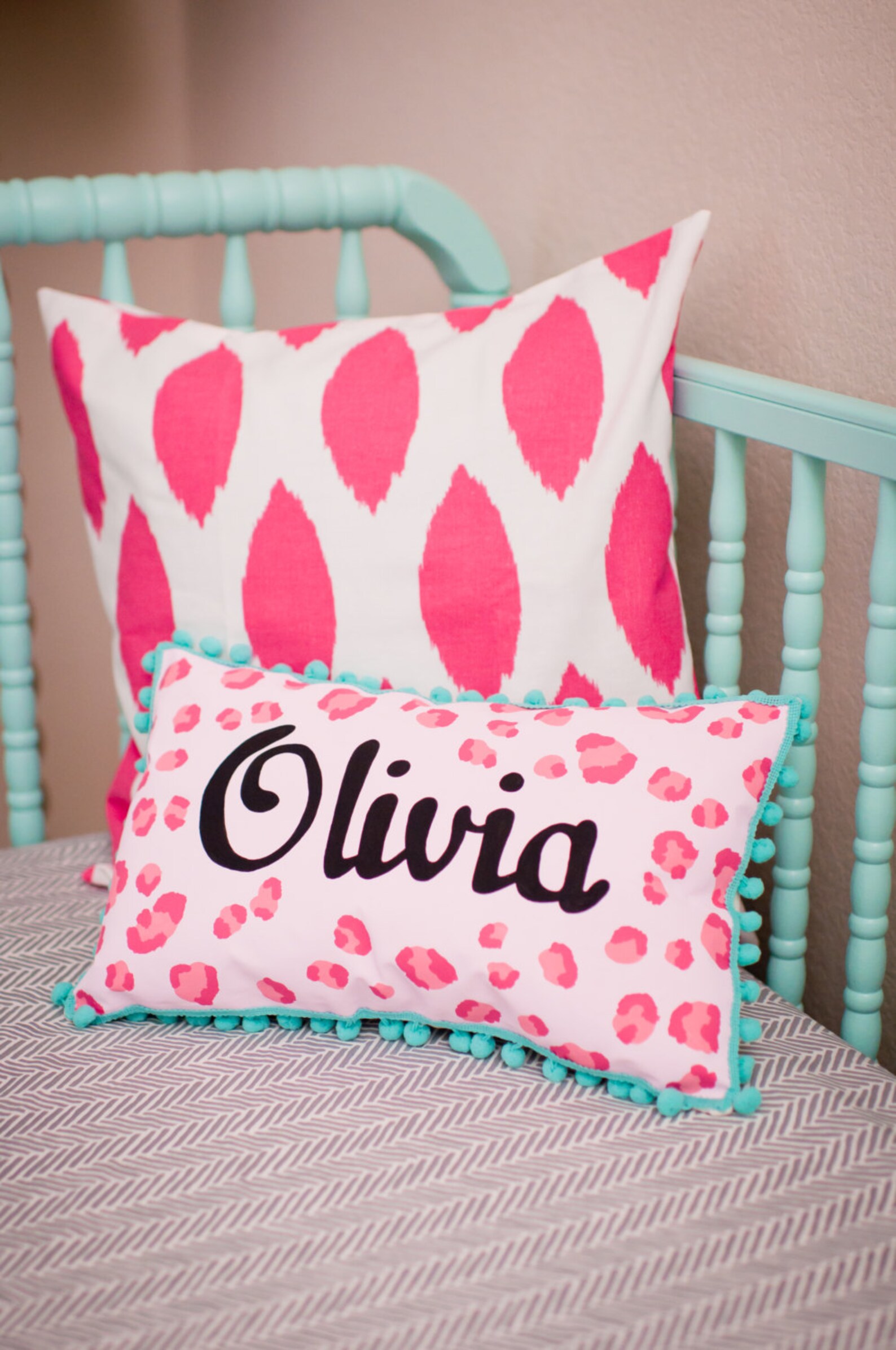 Baby pillow in bright pink leopard print and turquoise pom pom | Etsy