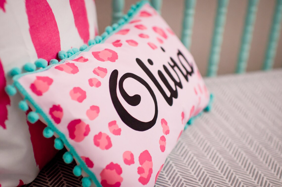 Baby pillow in bright pink leopard print and turquoise pom pom | Etsy